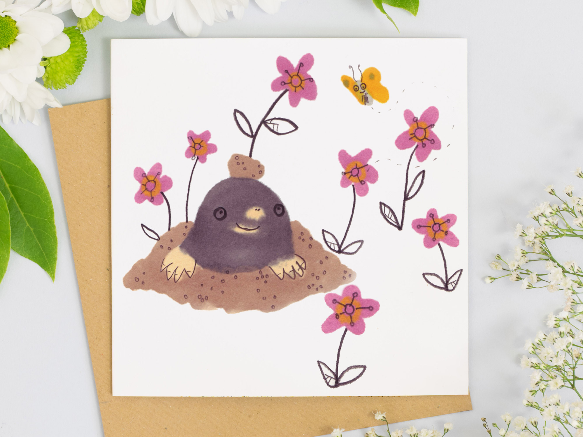 Little mole birthday card saying hello beneath pretty flowers and ...